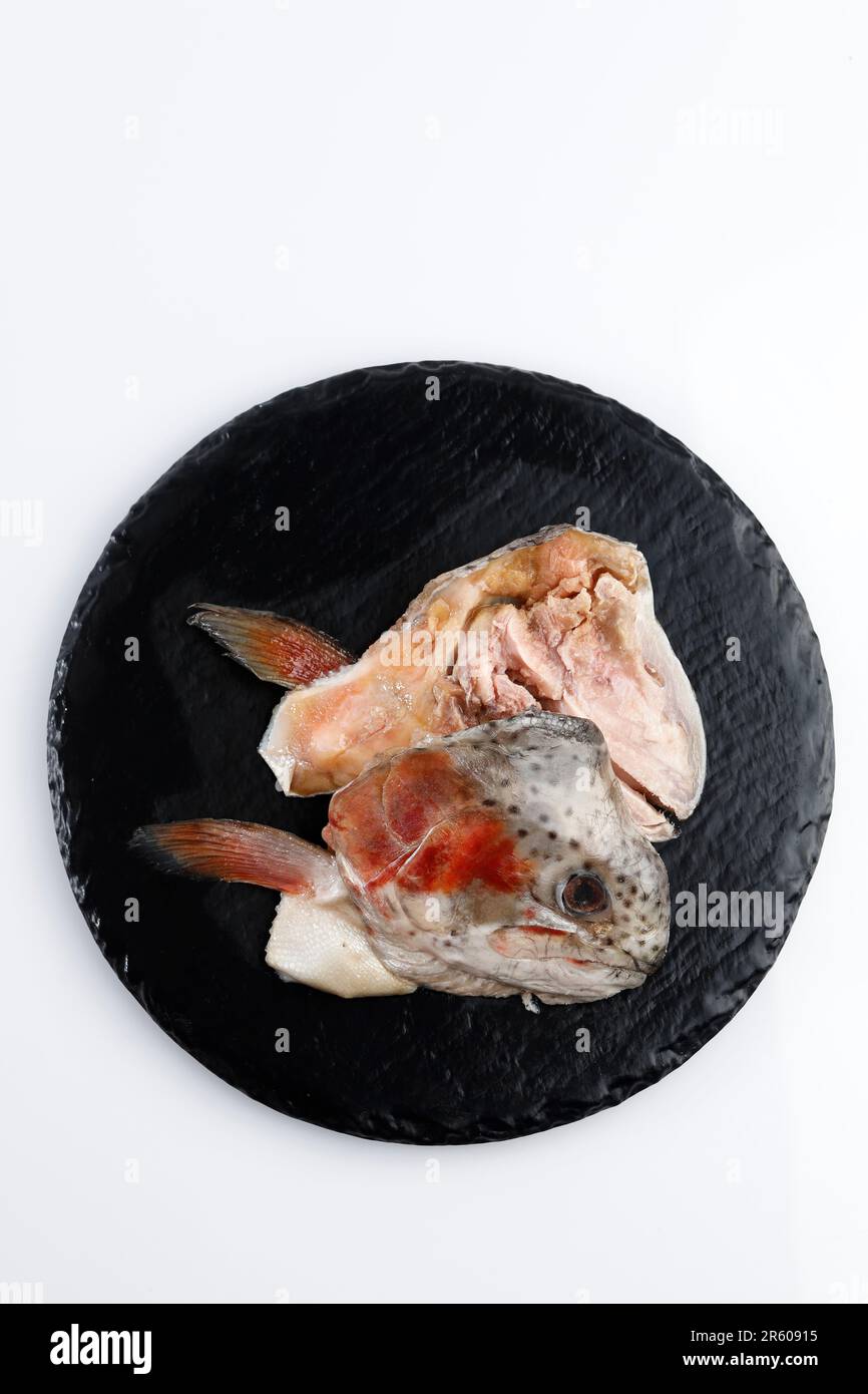 Frozen Salmon Fish Head Ready to Cook, Top View on SLate Plate Stock ...