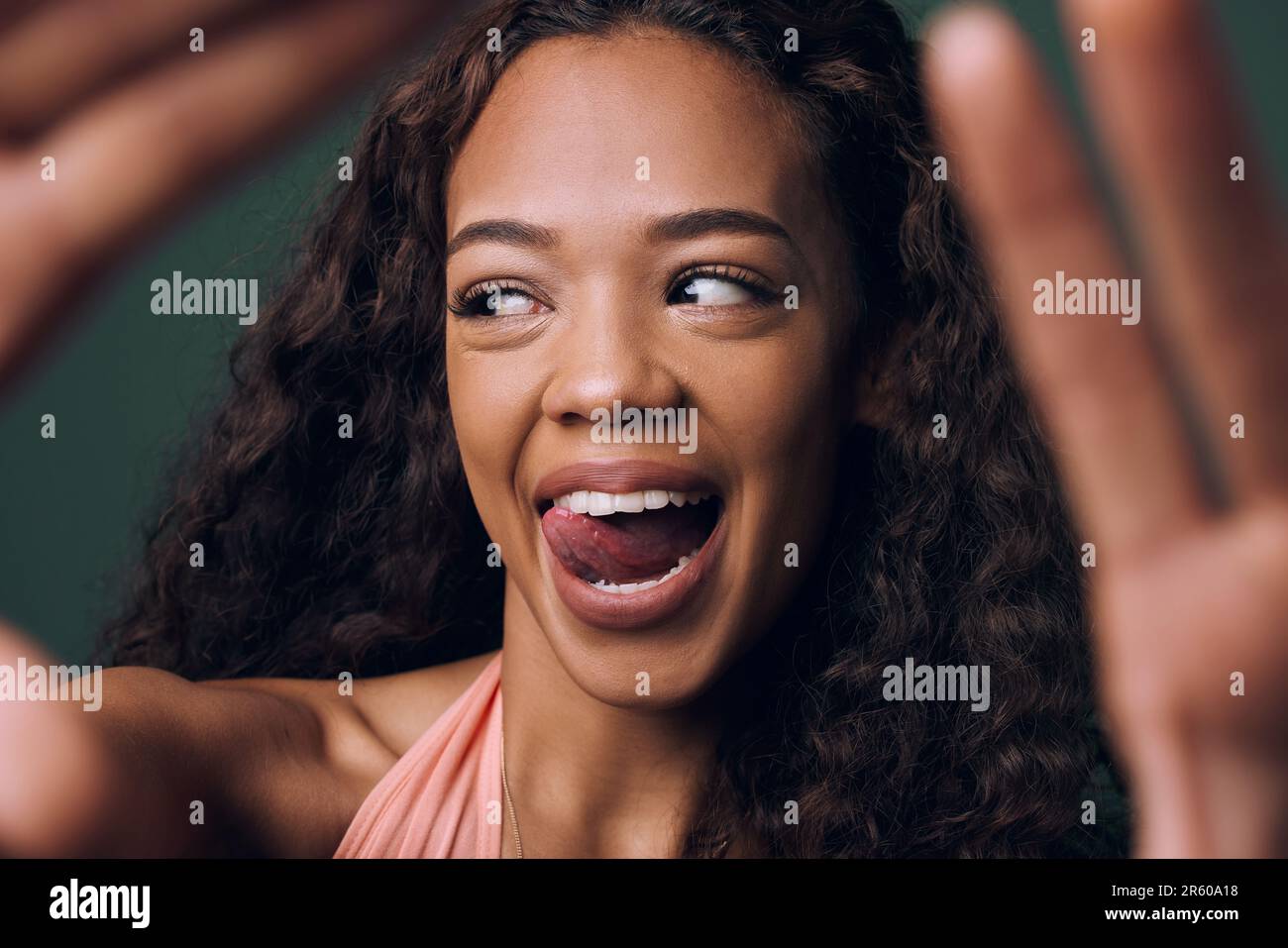 Selfie, tongue out and happy gen z girl with natural beauty, hair or ...