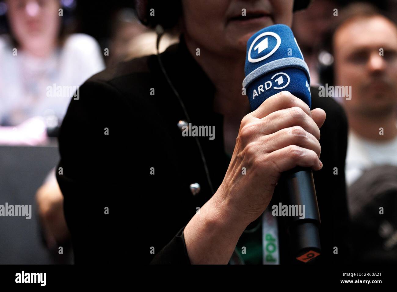 06 June 2023, Berlin: A visitor speaks into an ARD microphone in the ...