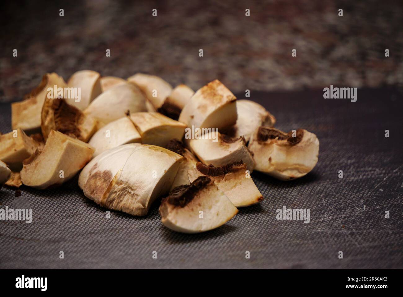 Chopped mushrooms close up view in the kitchen Stock Photo - Alamy