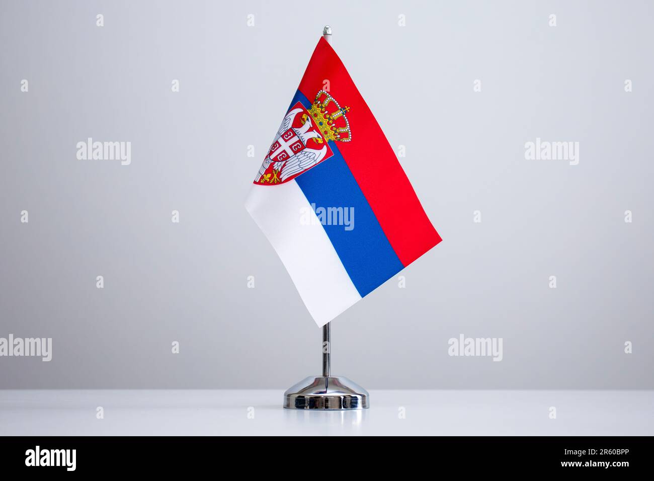 Small national flag of the Serbia on a white background Stock Photo - Alamy