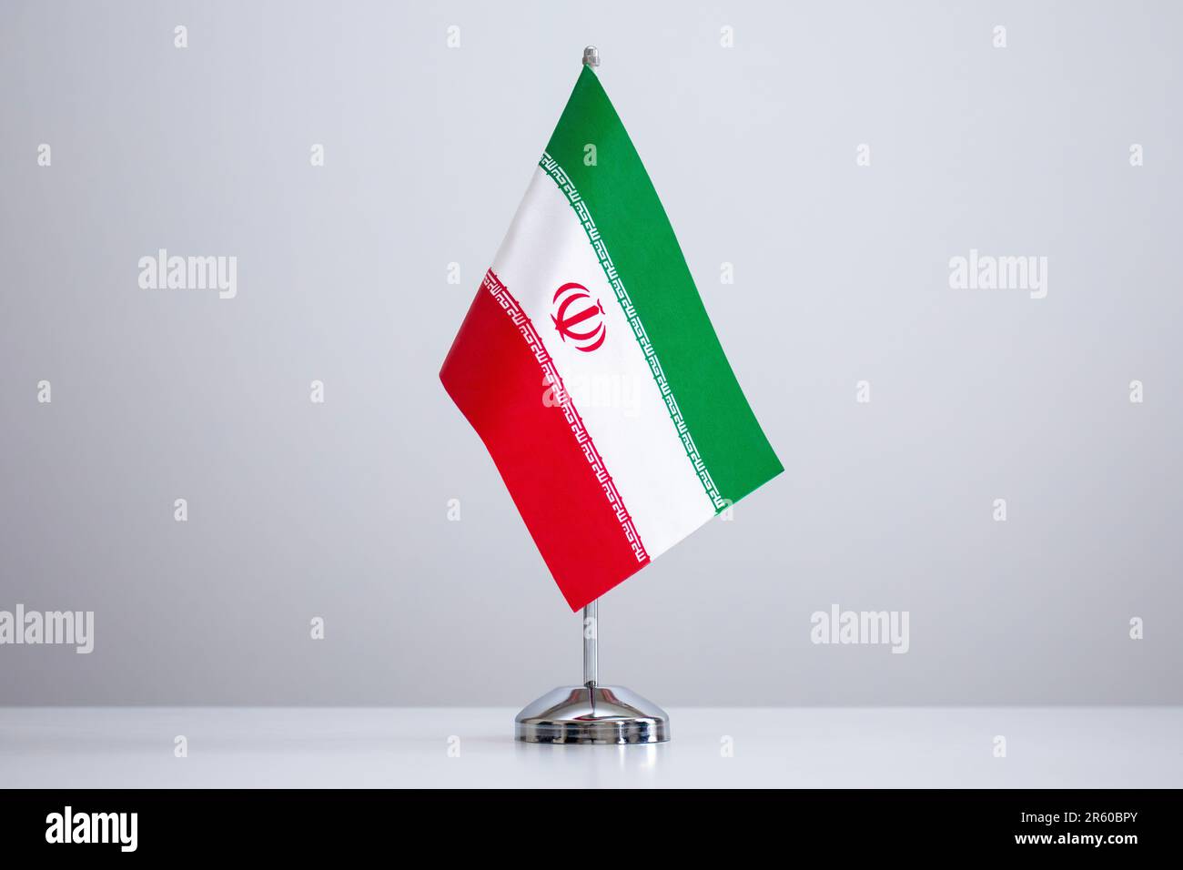 Small national flag of the Iran on a white background Stock Photo - Alamy