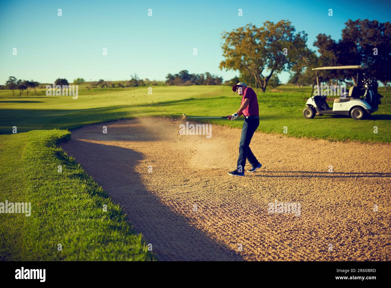 Mondays are sand traps in the fairway of life. a golfer chipping his ...