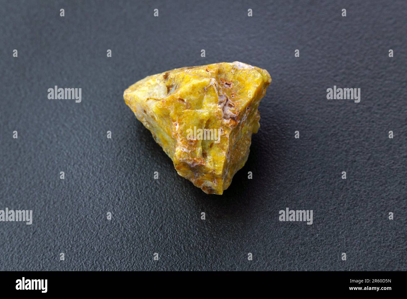 Rare boulder opal, mineral, black background. Opal is a hydrated ...