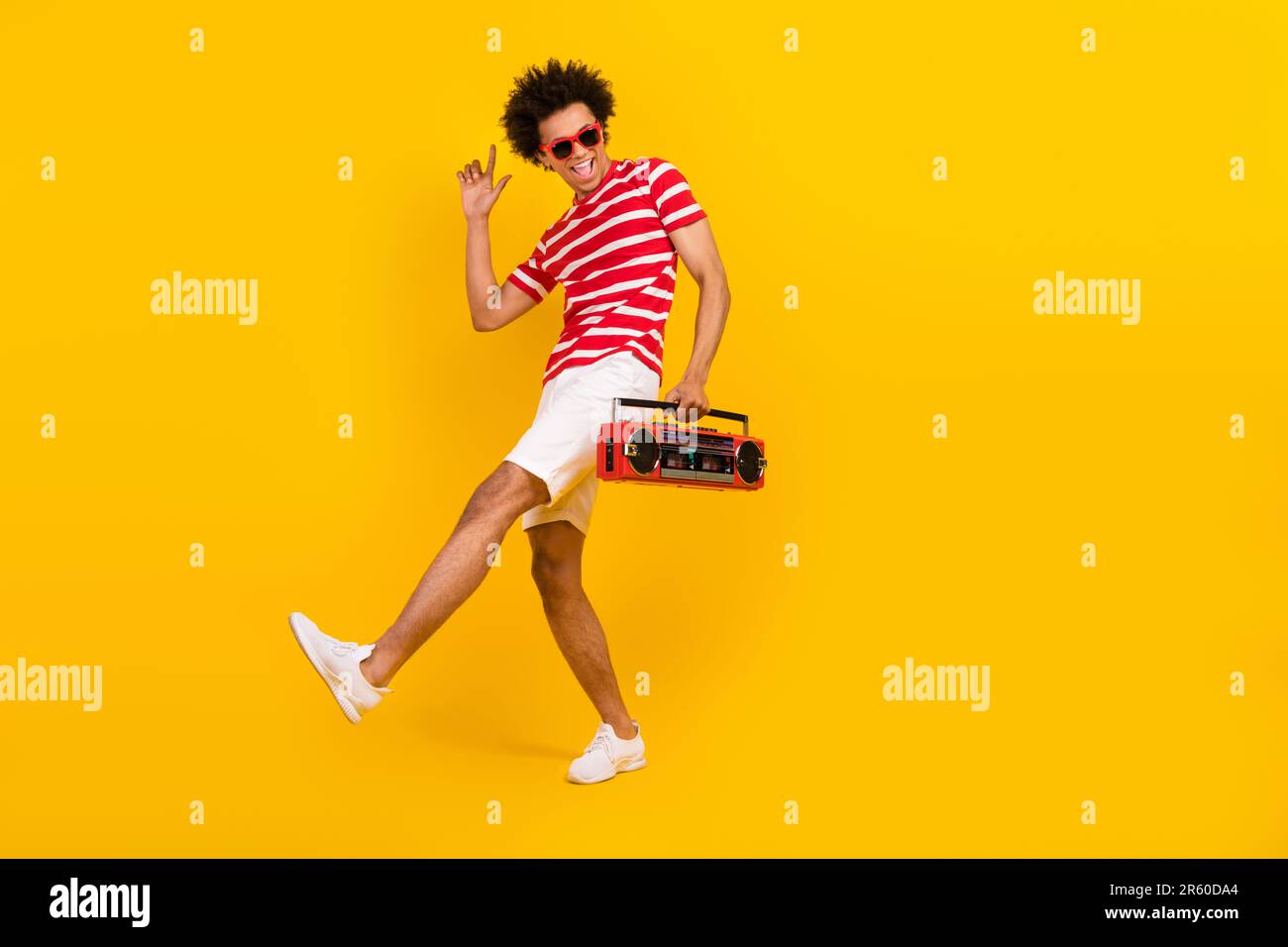 Full length photo of cool funky guy dressed red t-shirt dark glasses ...