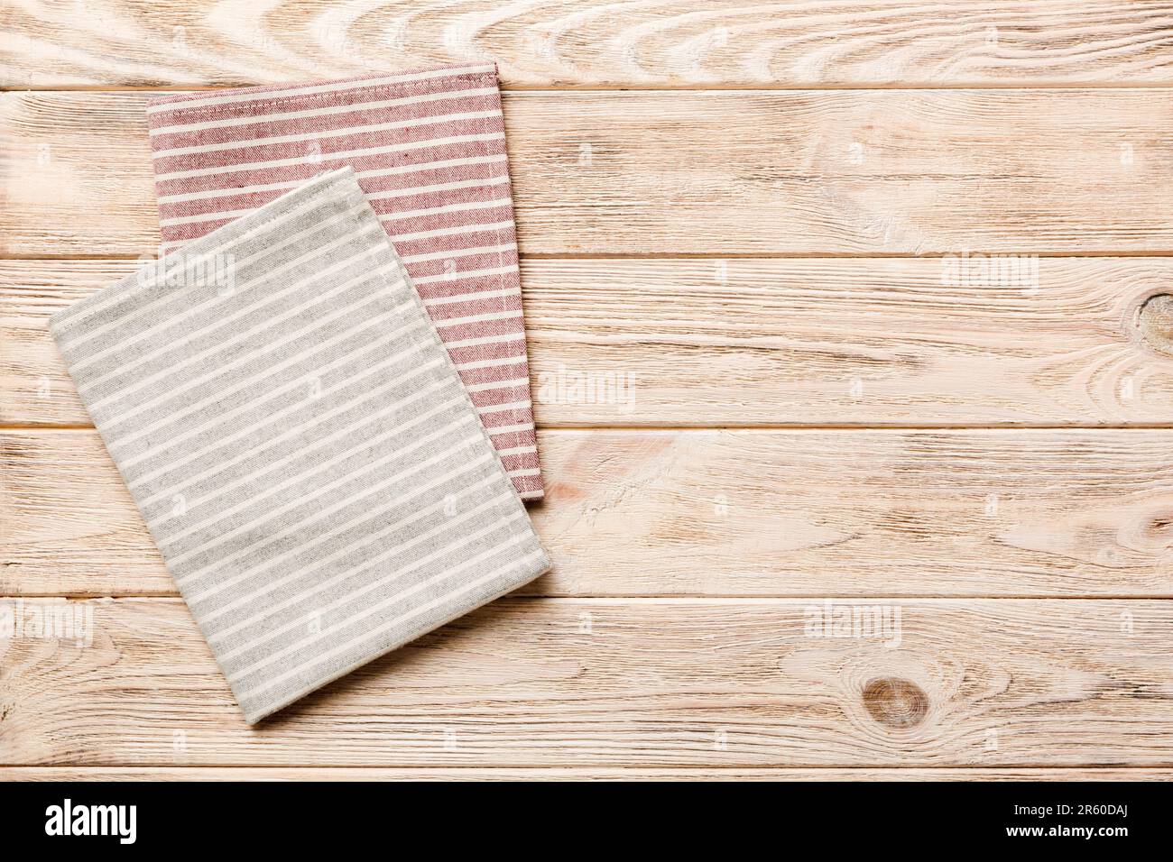 top view with gray kitchen napkin isolated on table background. Folded ...