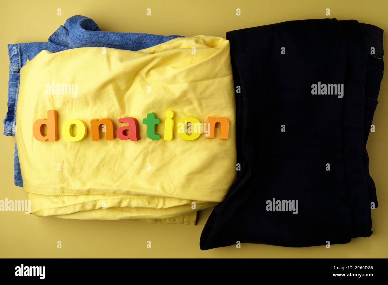 Jeans with the inscription donation, concept of helping people in need ...