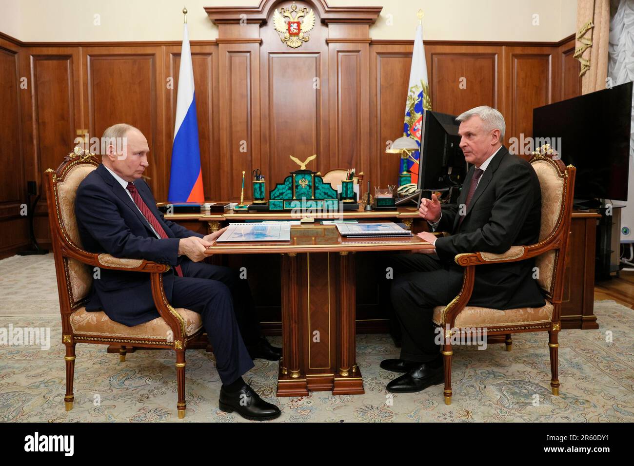 Russian President Vladimir Putin, left, listens to Governor of Magadan ...