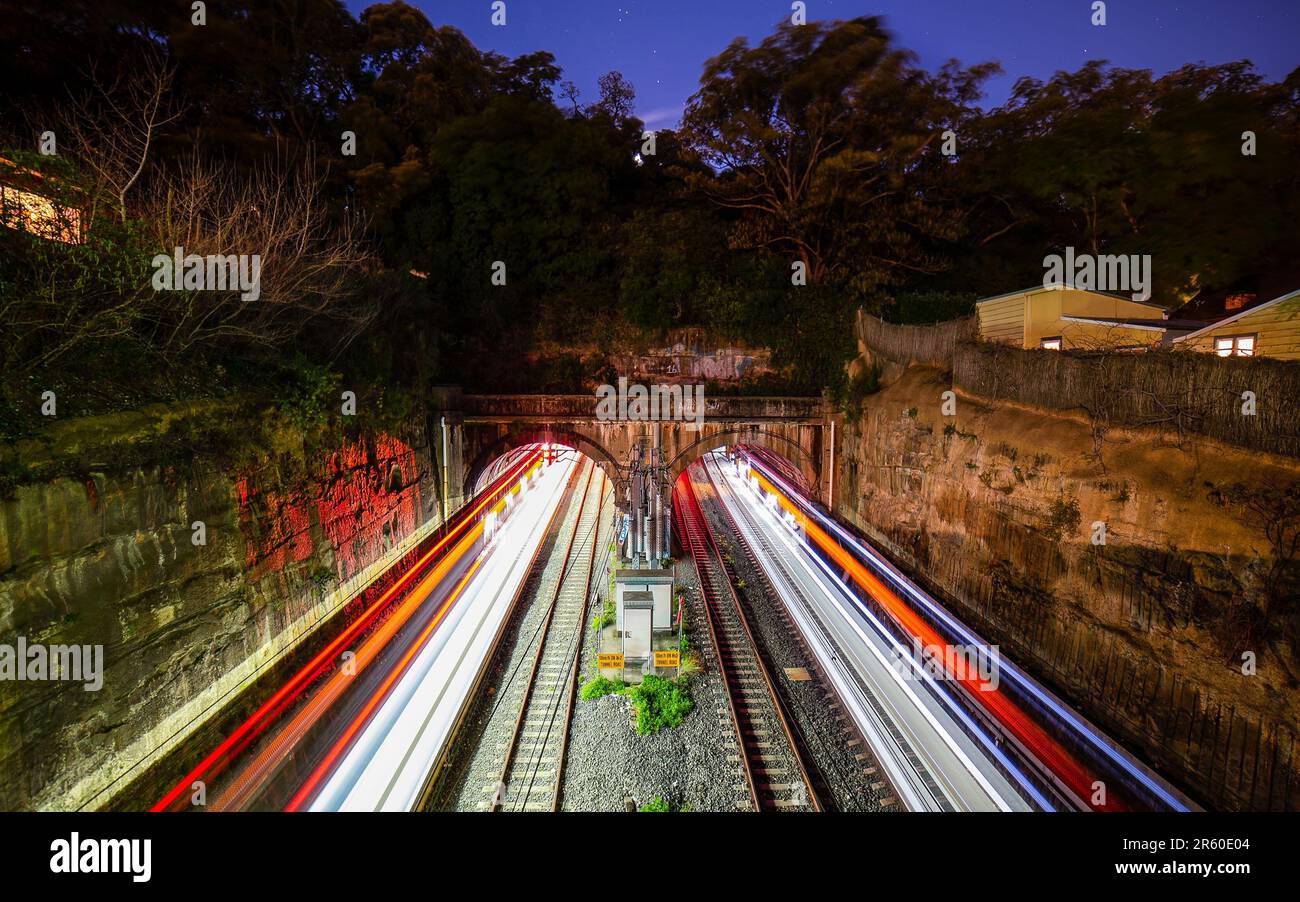 The train tracks at night illuminated by light trails Stock Photo - Alamy