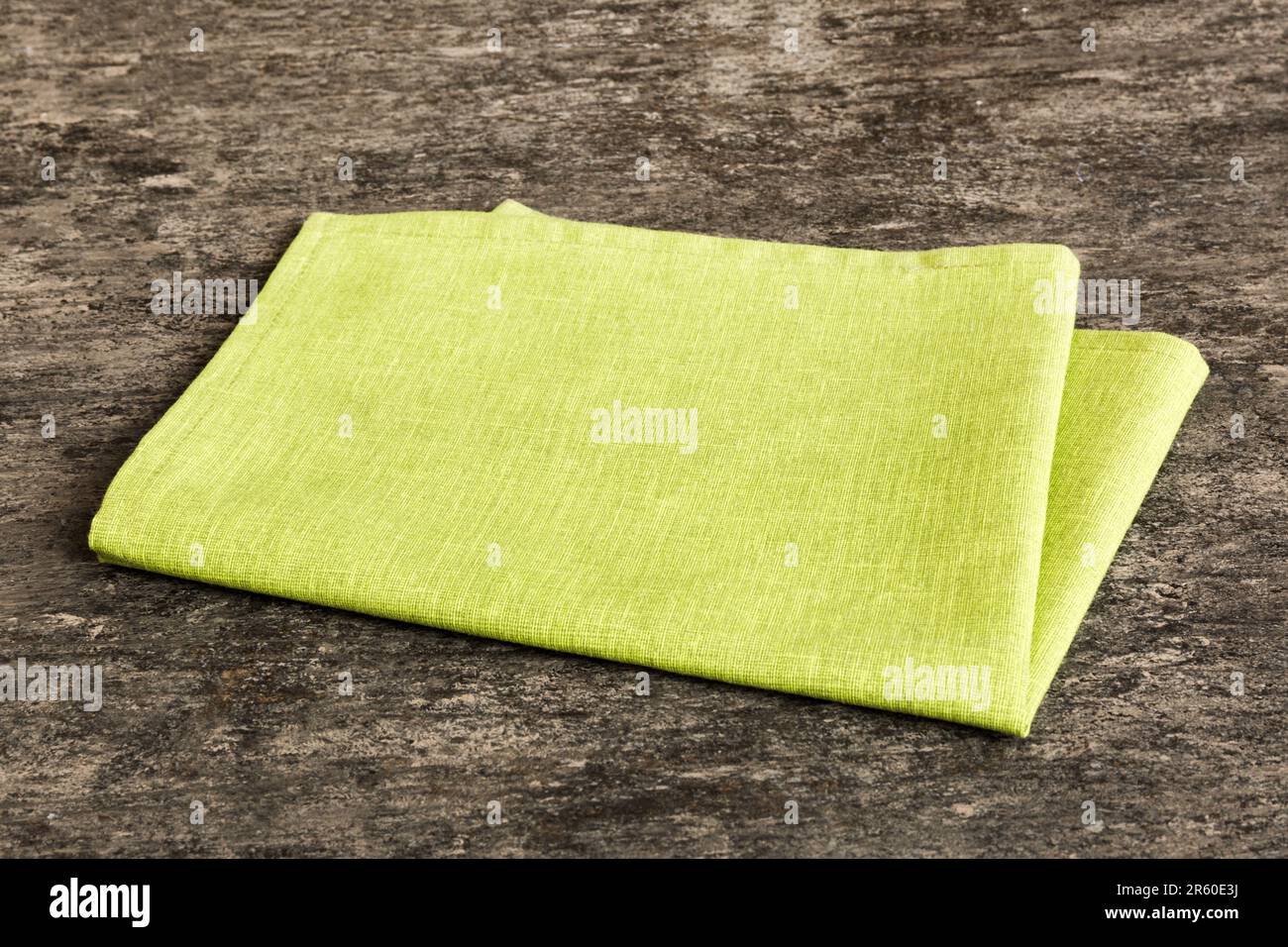 top view with green kitchen napkin isolated on table background. Folded ...