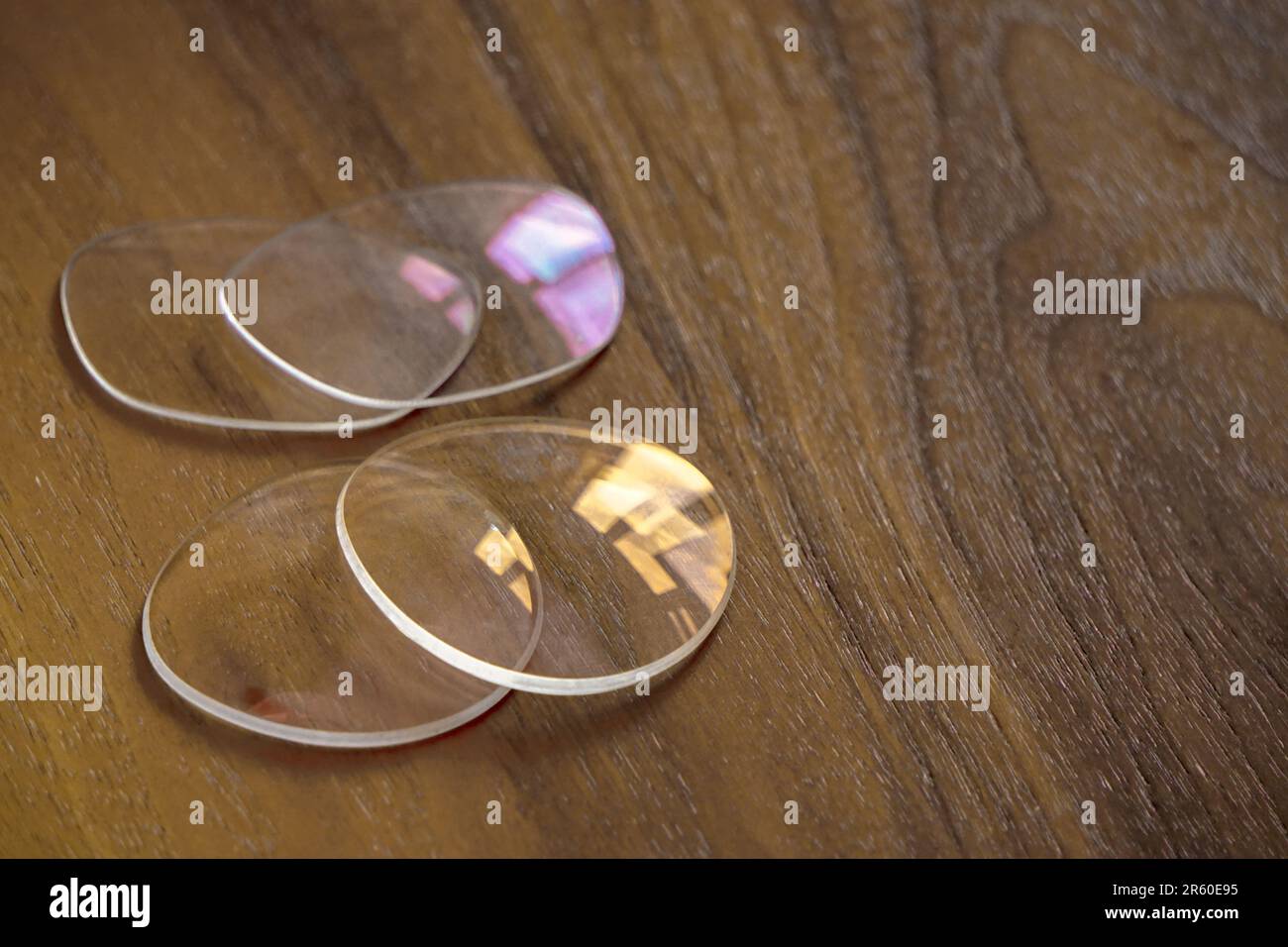Old glasses lenses on Wooden background Stock Photo - Alamy