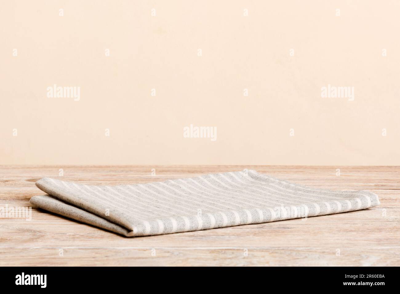 top view with gray kitchen napkin isolated on table background. Folded ...