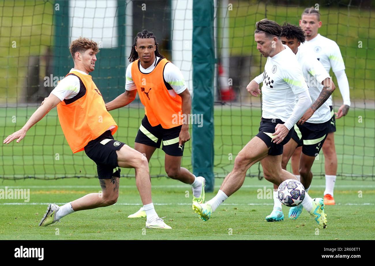 Manchester City's John Stones (left), Kalvin Phillips and Jack Grealish ...