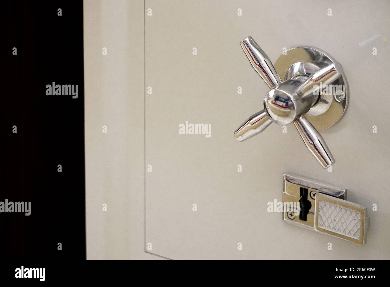 Grey colored steel safe close up view Stock Photo - Alamy