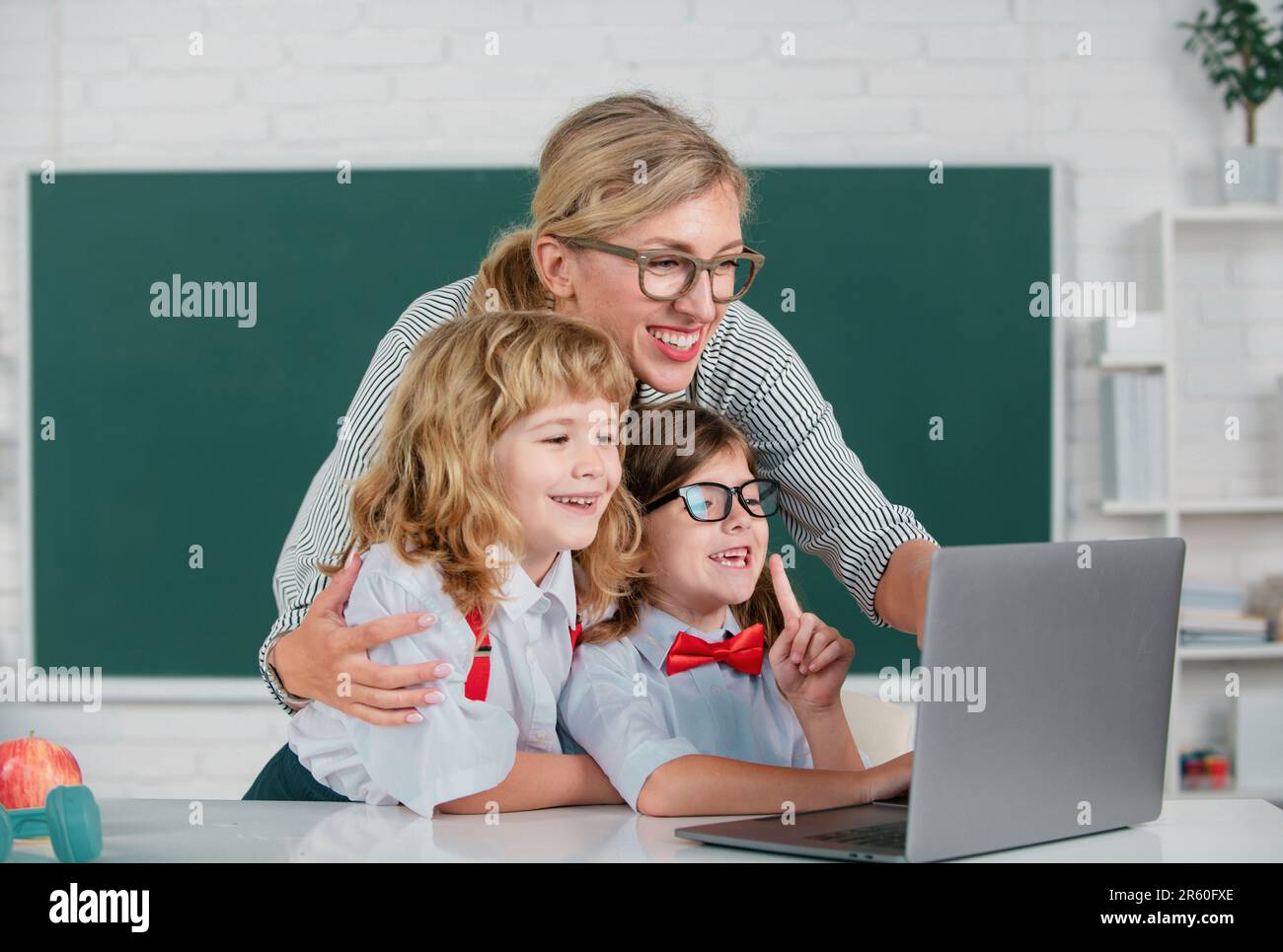 First day at school. Cute little boy from elementary school and tutor ...