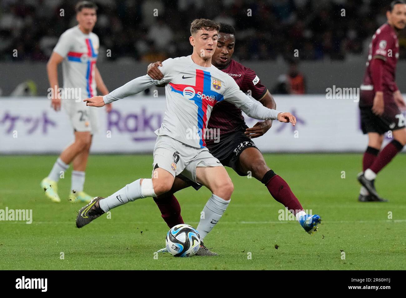 Barcelona's Pablo Torre, left, and Vissel Kobe's Jean Patric battle for ...