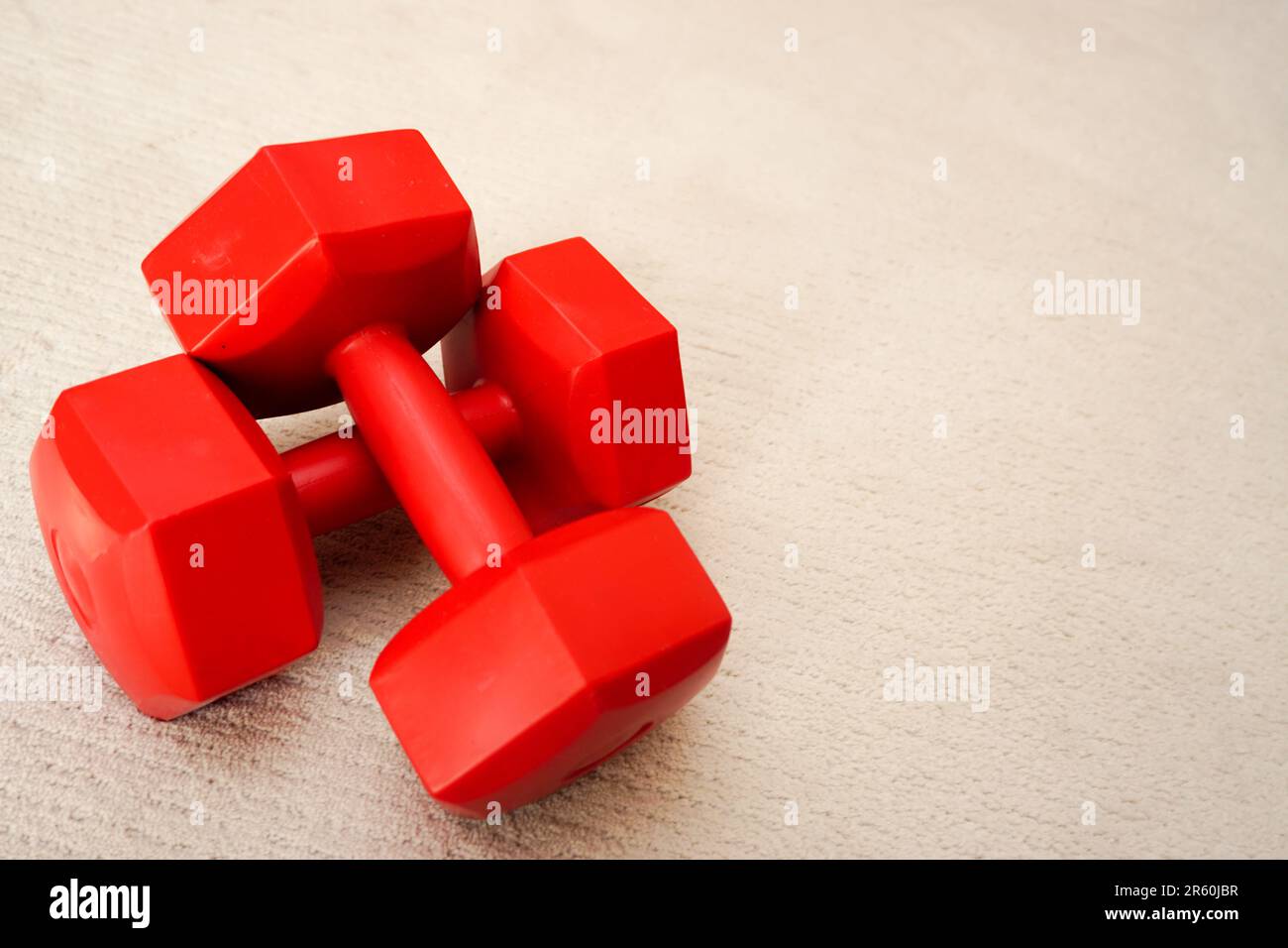 Set of red dumbbells on isolated background Stock Photo - Alamy