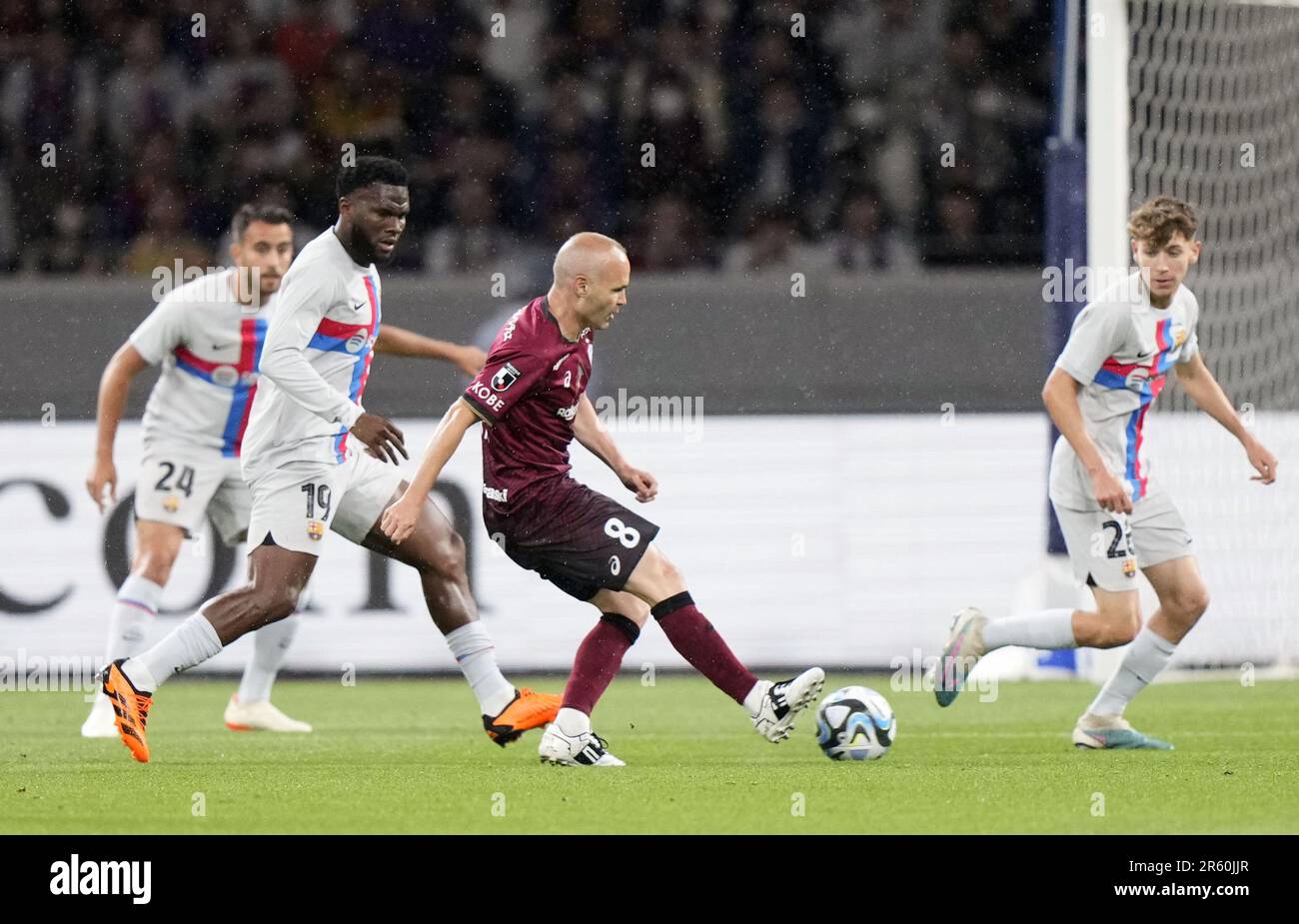 Vissel Kobe star Andres Iniesta (2nd from R) sends a pass during the ...