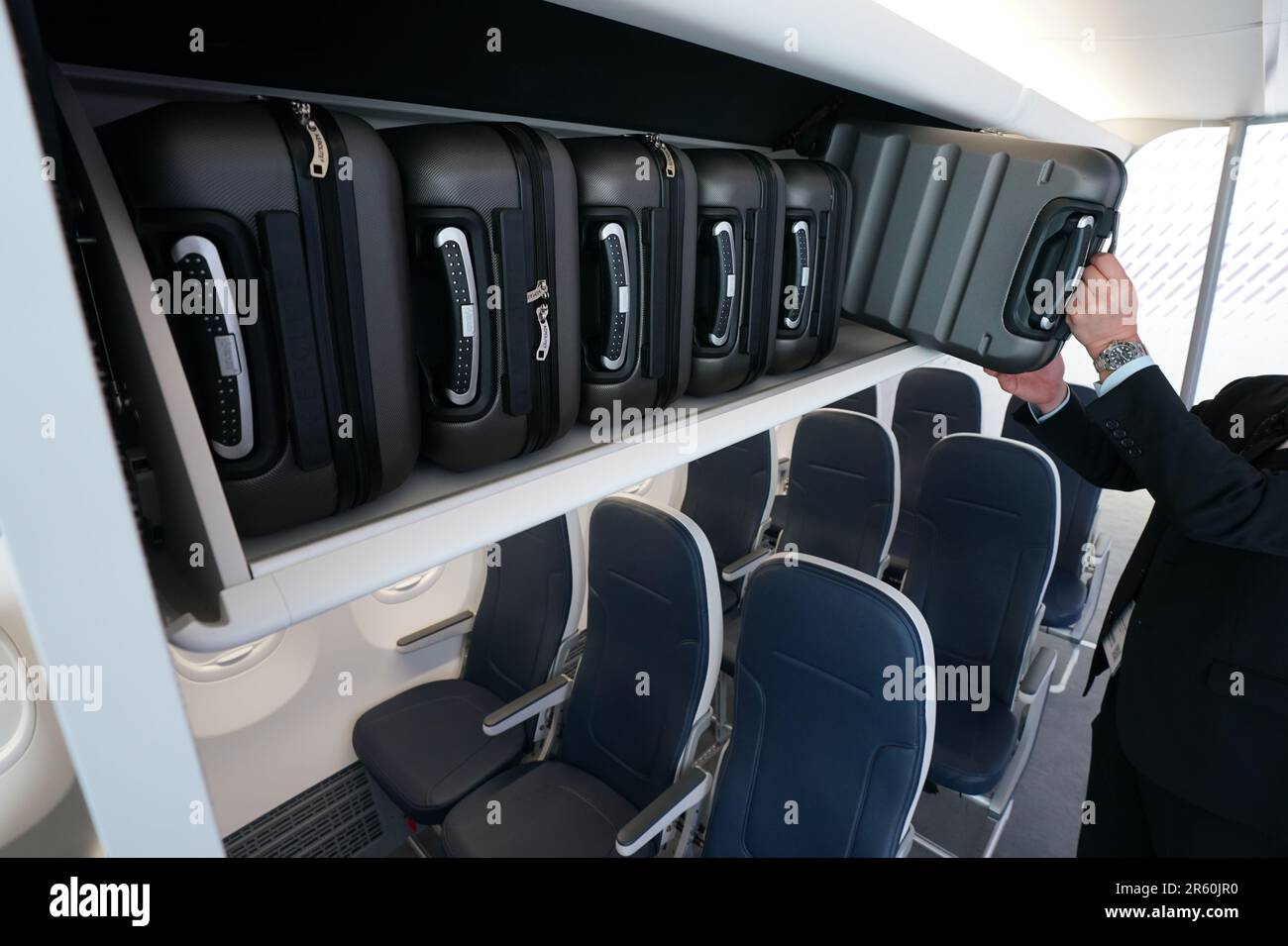 Hamburg, Germany. 06th June, 2023. An employee pulls a suitcase from ...