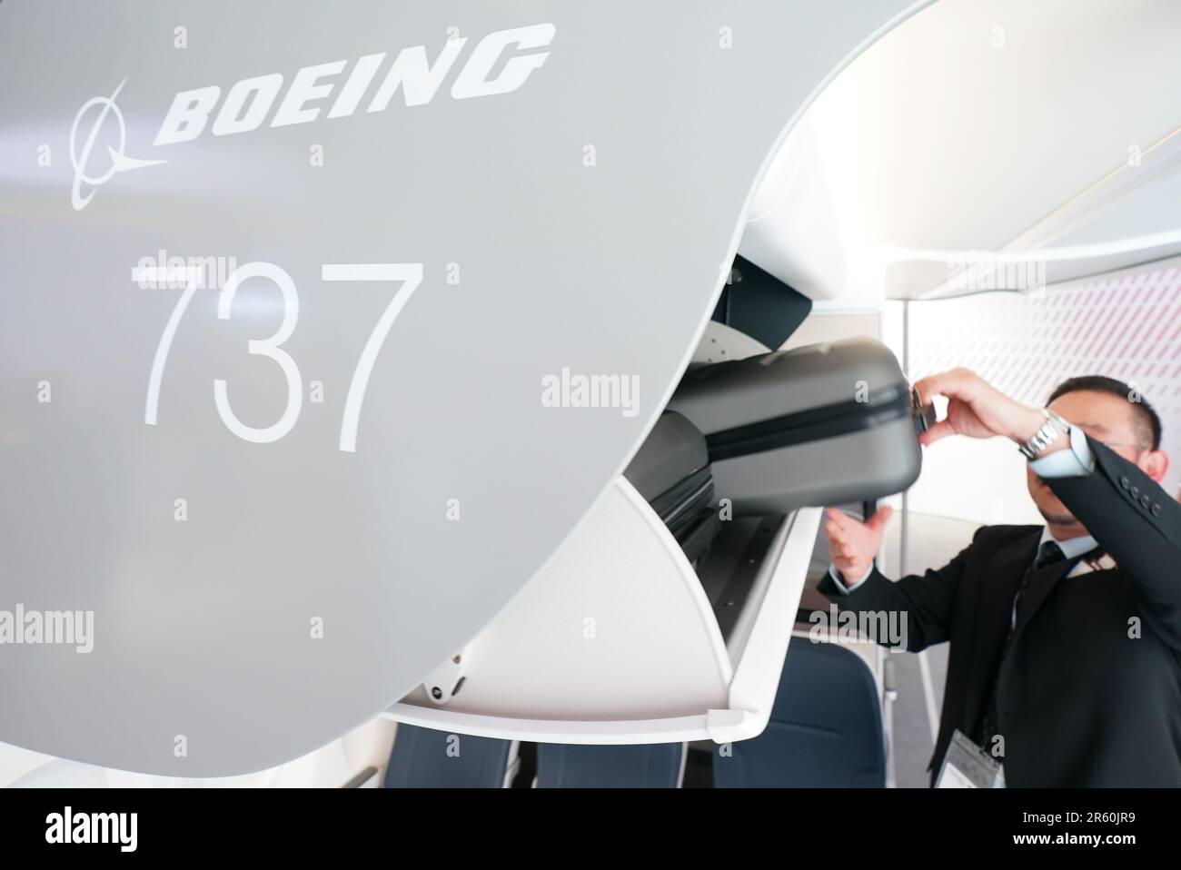 Hamburg, Germany. 06th June, 2023. An employee pulls a suitcase from ...