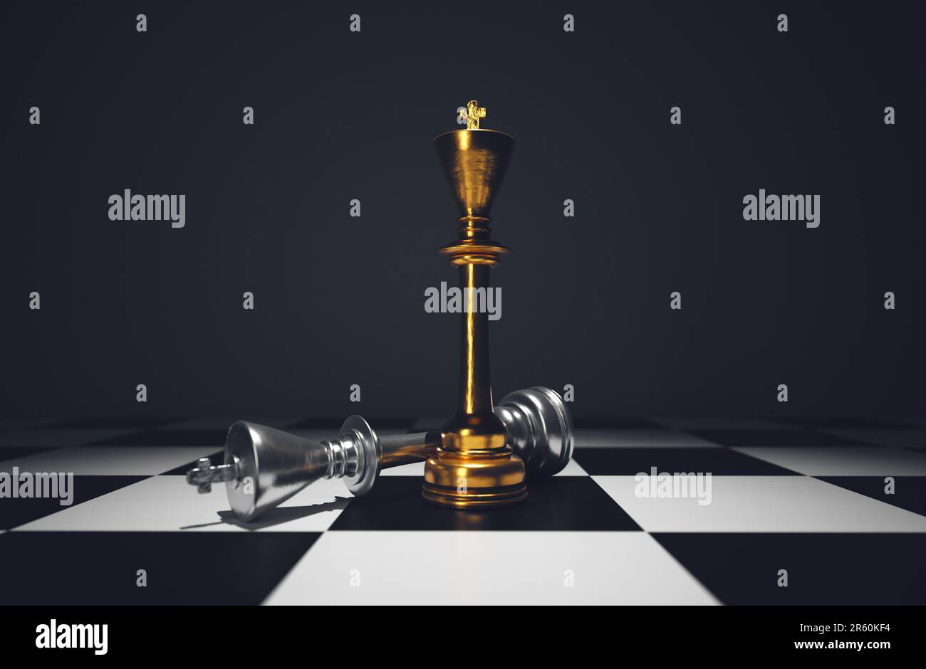Golden chess king standing over the fallen silver king on a chess board ...