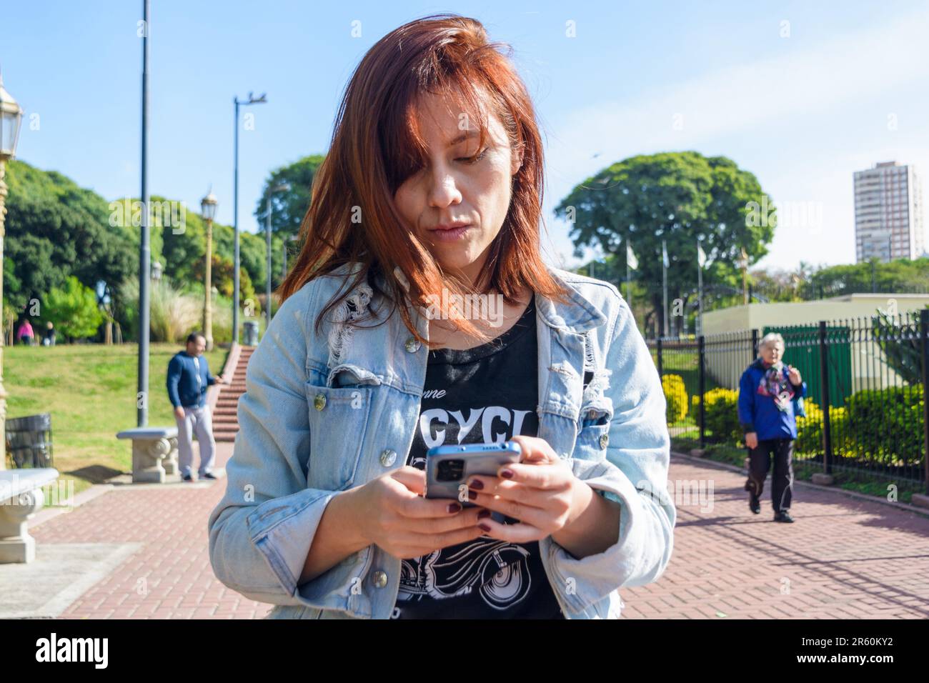 front view of young latin colombian woman with red hair, for serious ...