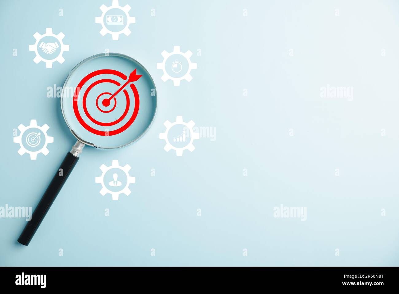 Magnifier in hand, close-up analysis of a target icon Stock Photo - Alamy