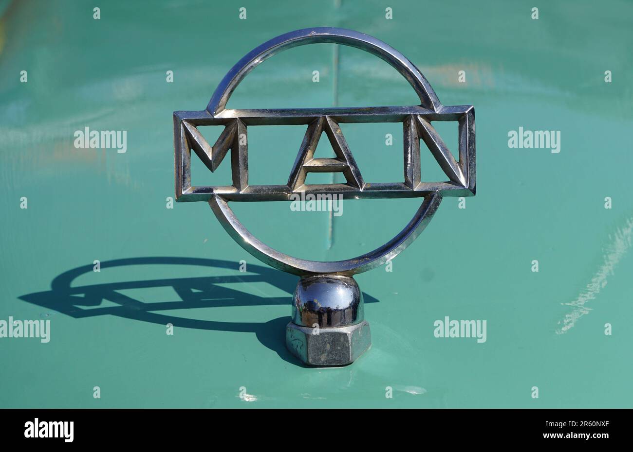 A vintage car Man logo illuminated by the sun's rays Stock Photo - Alamy