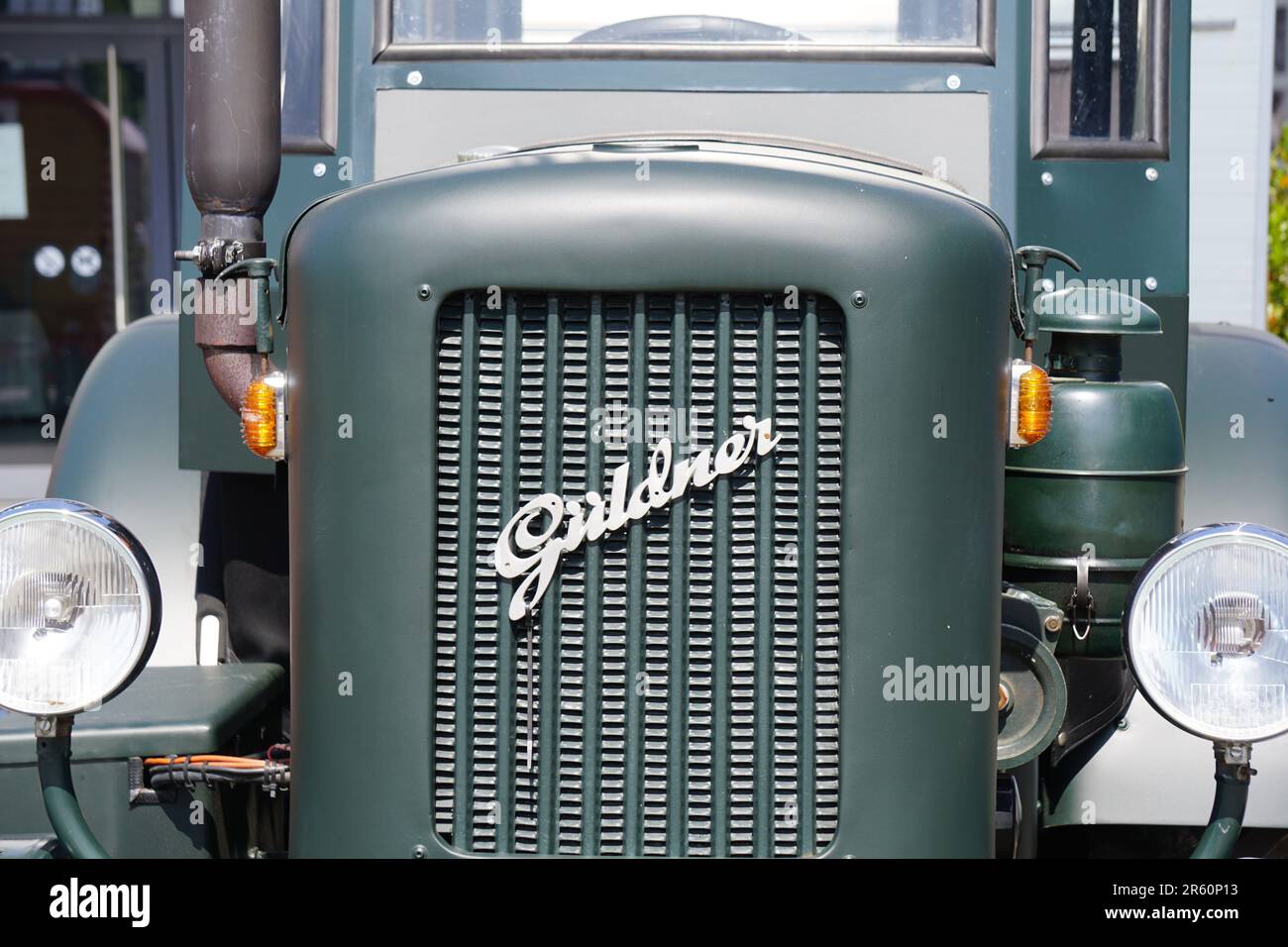An aged green Guldner automobile parked in a parking lot Stock Photo ...