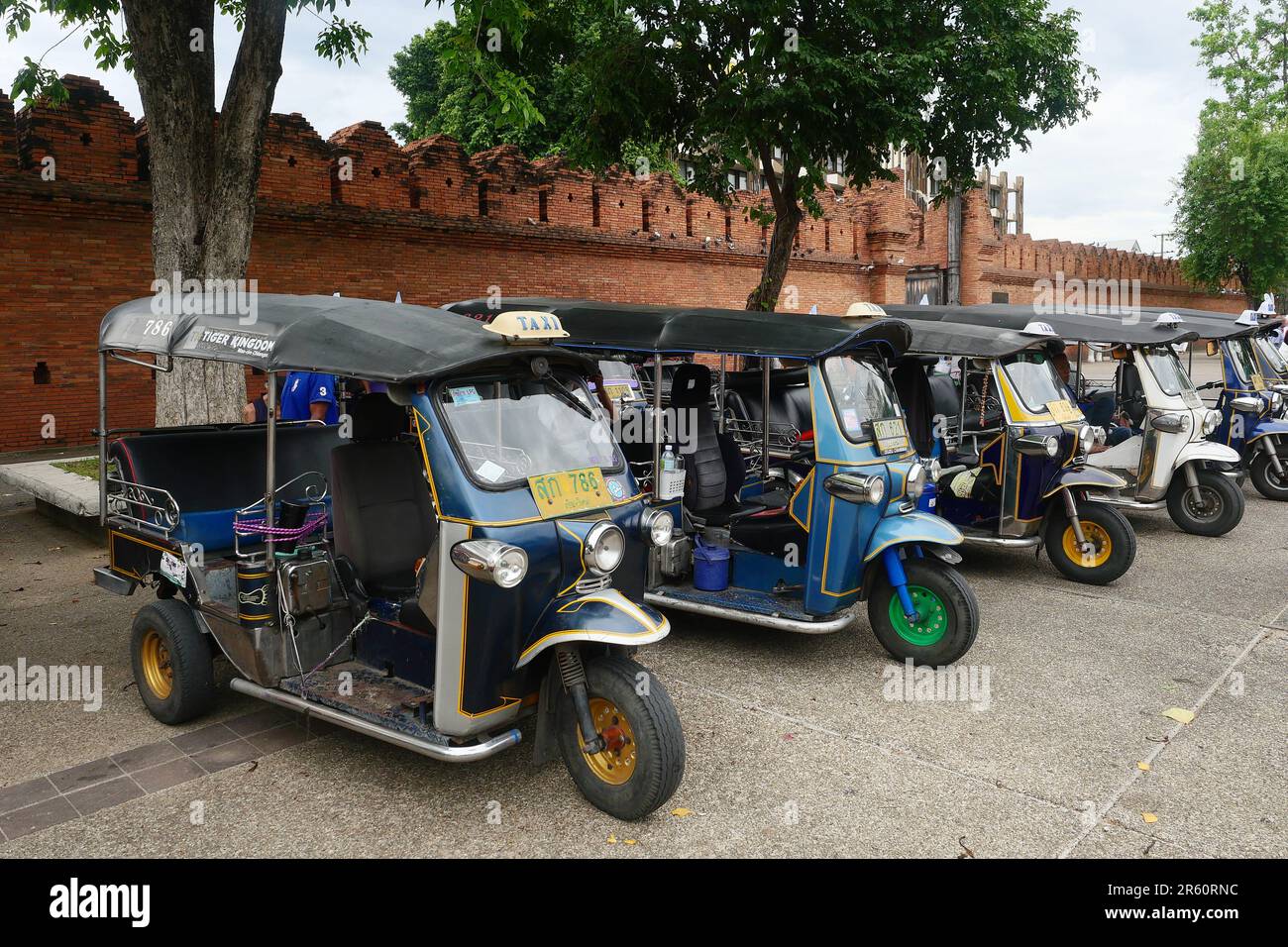 Thai Tuk Tuk taxi at Thapae gate famous place in Chiang-Mai, Thailand Stock Photo - Alamy