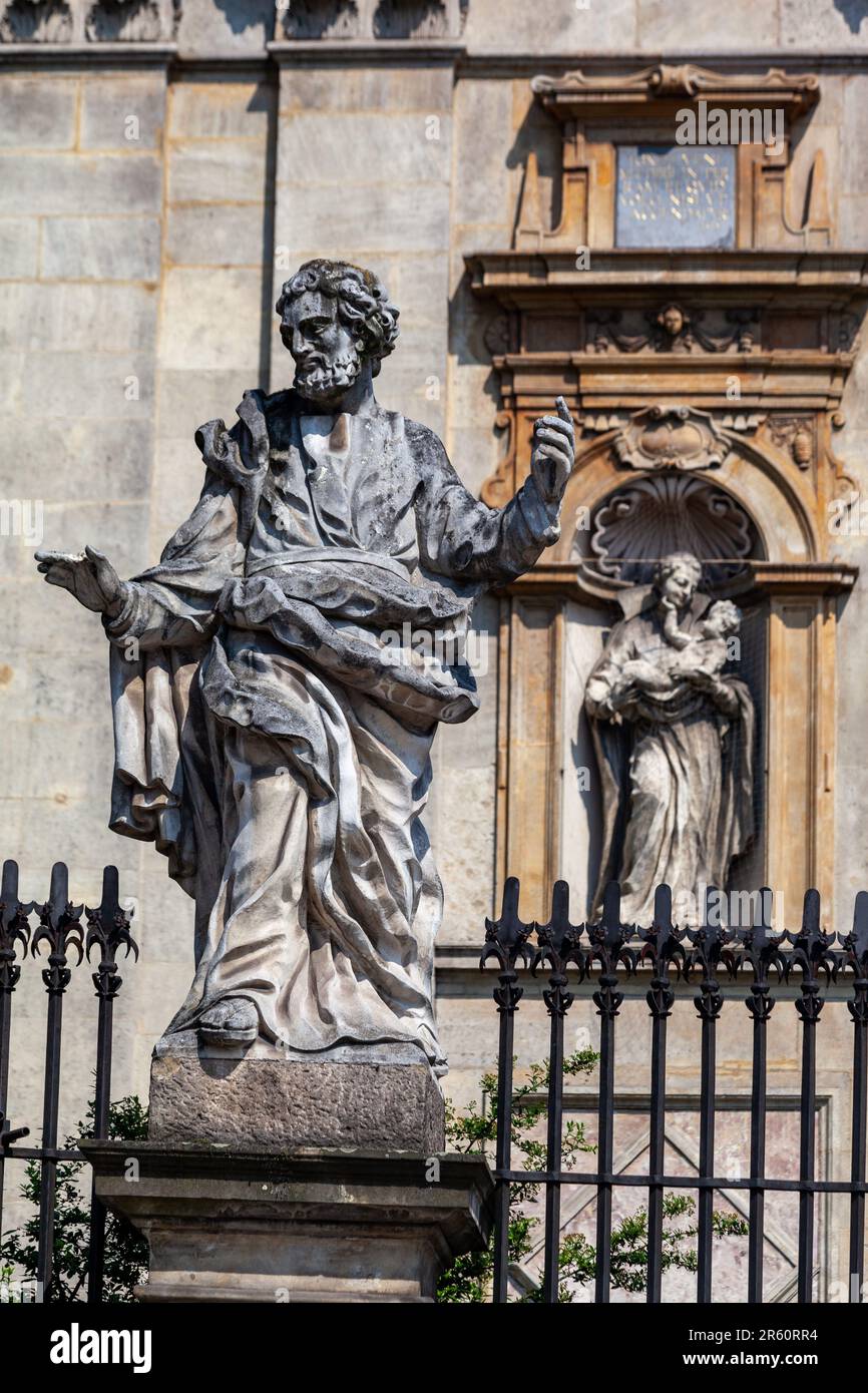 A bronze sculpture of the god and goddess standing in front of a ...