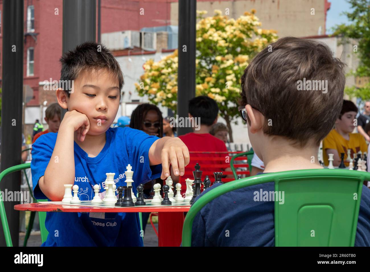 Washington, DC - Children play chess at the Eastern Market Metro Plaza ...