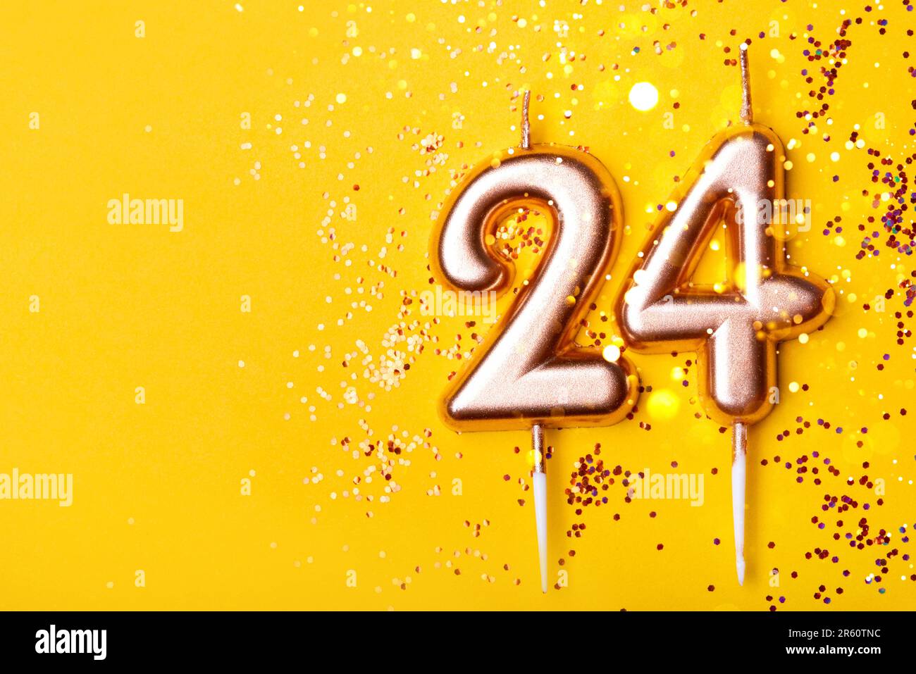24 years celebration. Greeting banner. Gold candles in the form of ...