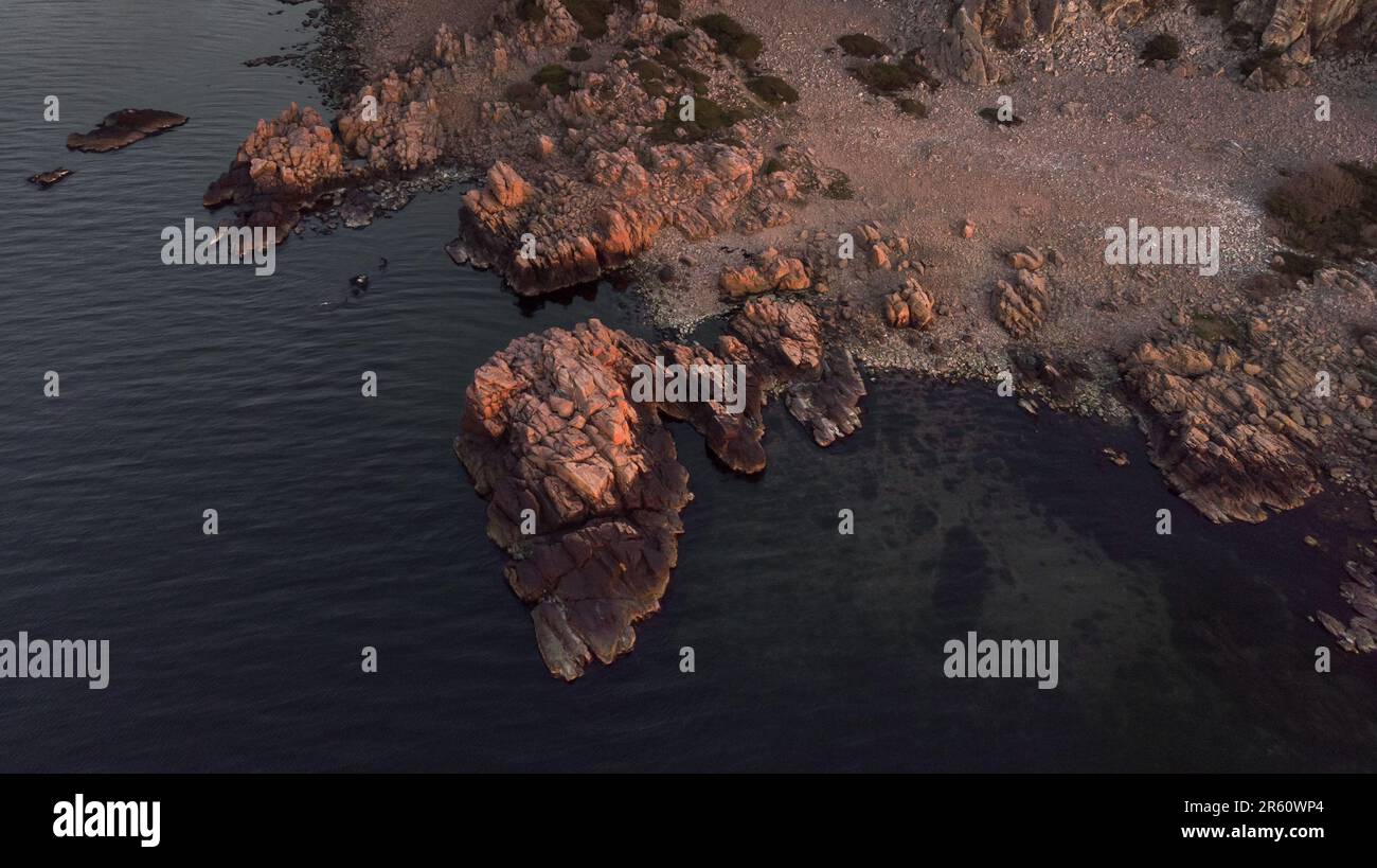An aerial view of a Swedish west coast surrounded by rock formations ...
