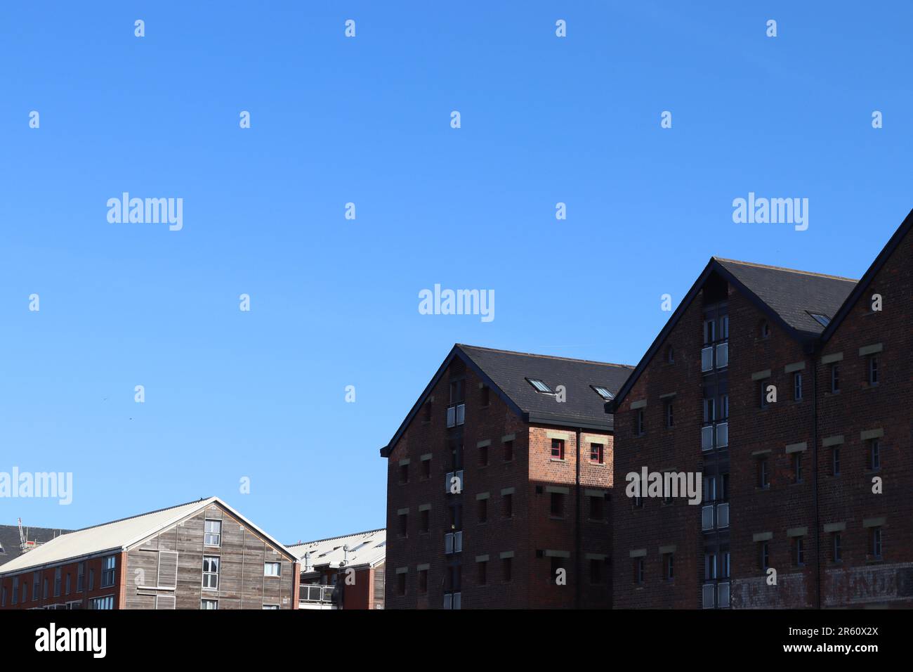 The two tall brick structures standing side by side illuminated by the ...