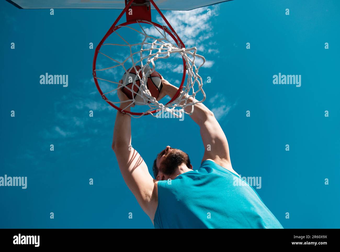 Basketball player. Sports and basketball. A young man jumps and throws ...
