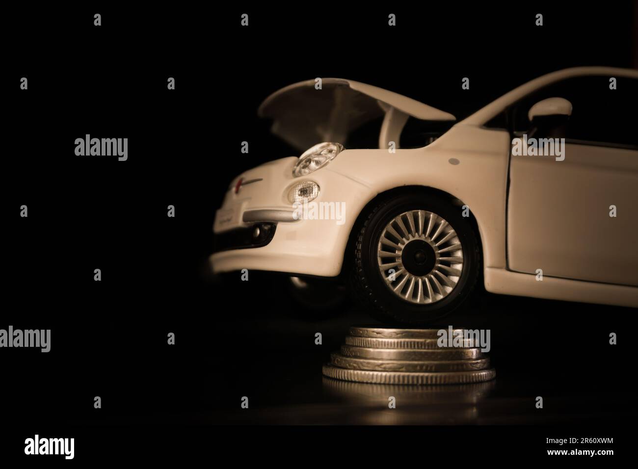 Car expenses illustration with miniature objects Stock Photo - Alamy