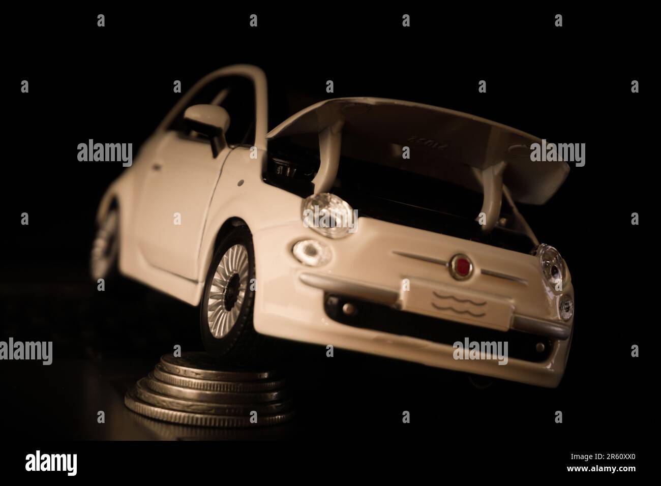 Car expenses illustration with miniature objects Stock Photo - Alamy