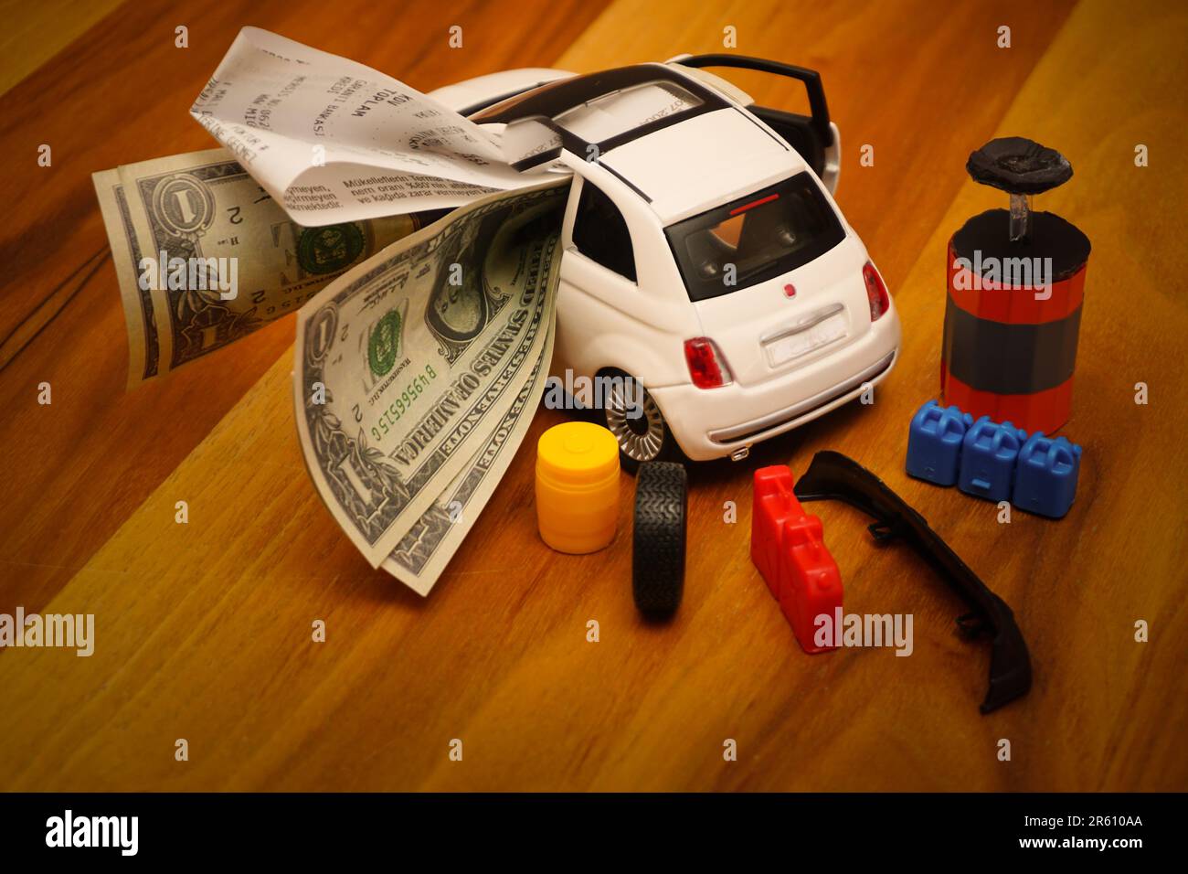 Car expenses illustration with miniature objects Stock Photo - Alamy