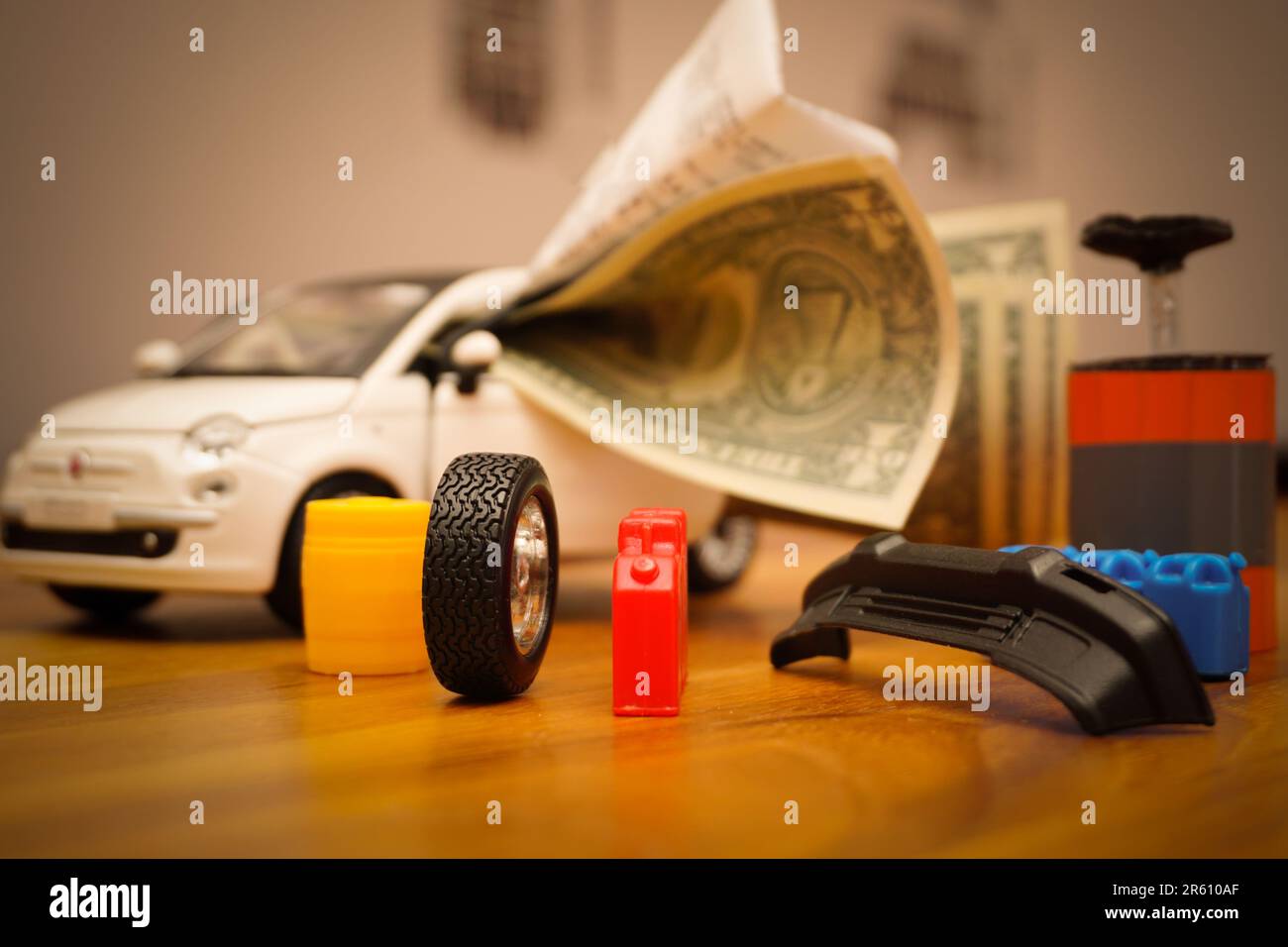 Car expenses illustration with miniature objects Stock Photo - Alamy