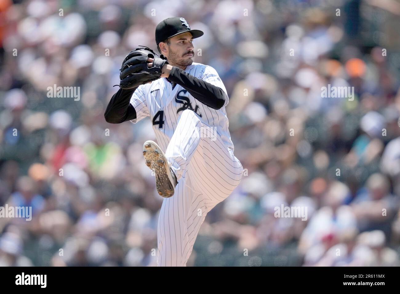 Chicago White Sox starting pitcher Dylan Cease winds up in a baseball ...