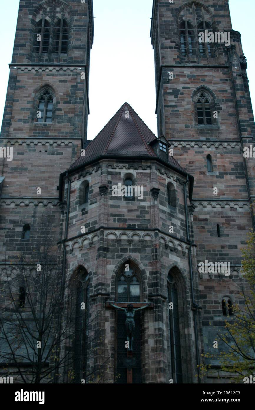 This image captures two ornate towers on a brick building Stock Photo ...