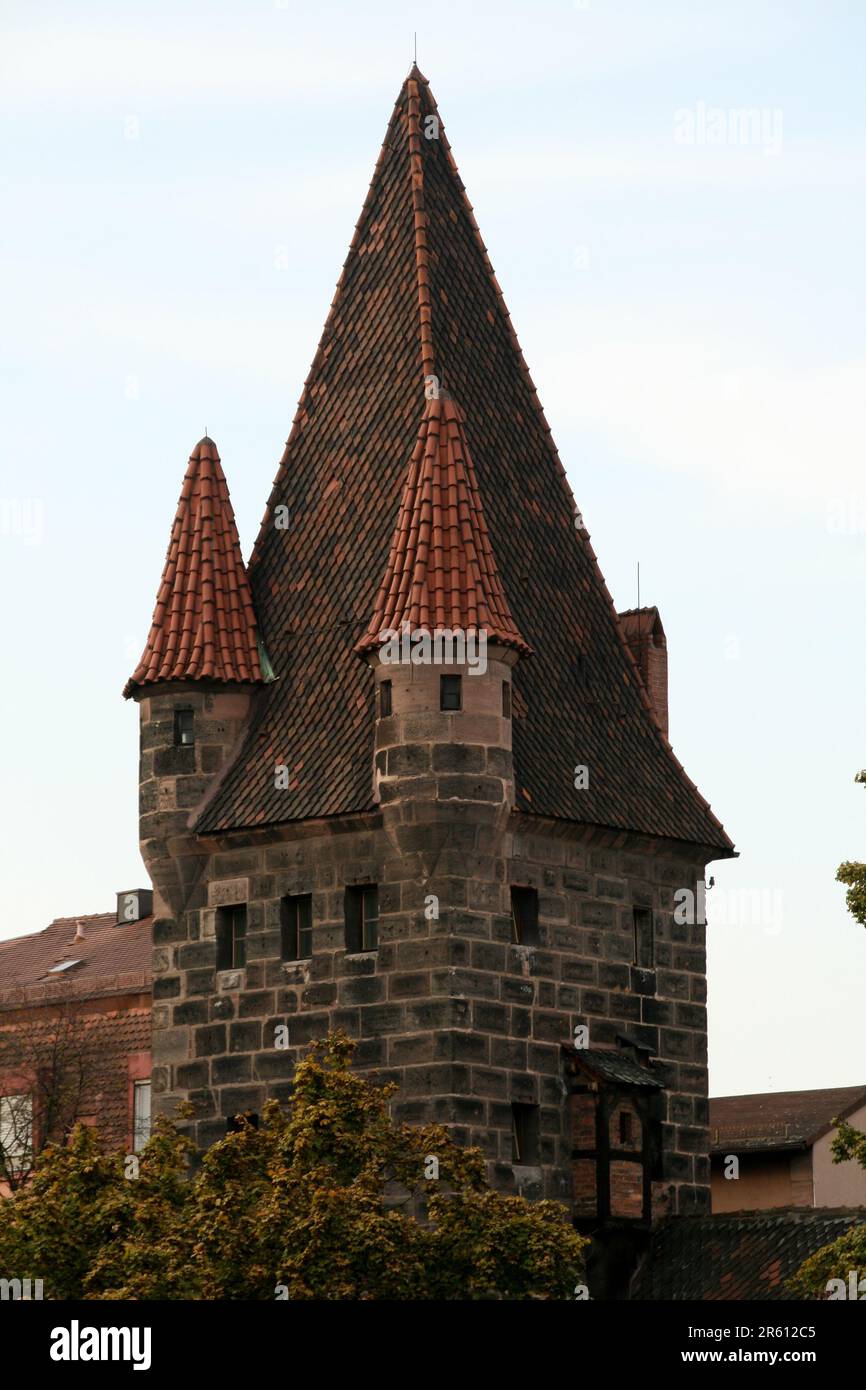 A majestic stone castle stands in the center of a vibrant residential ...