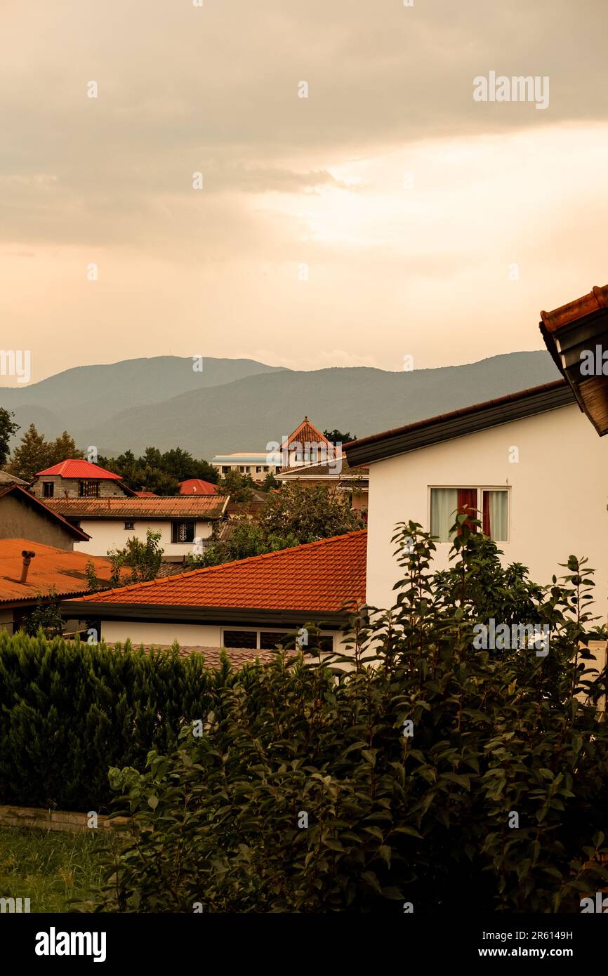 A multi-story apartment complex is situated on a hillside, its exterior ...