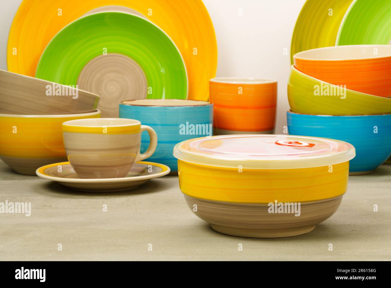 Set of colored ceramic dishware front view Stock Photo - Alamy