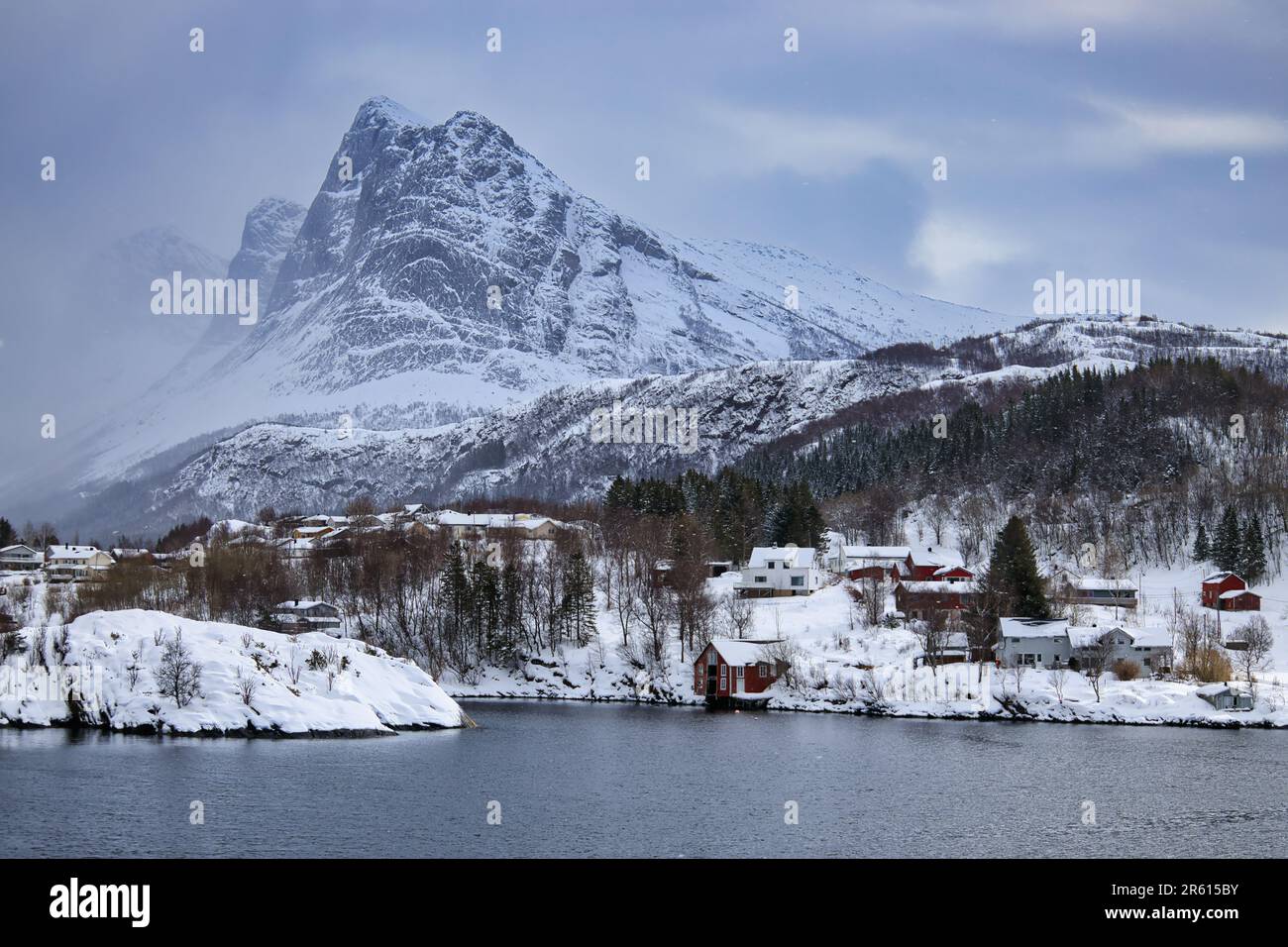 Tromso, Troms og Finnmark, Norway - mountains, coastline and harbour after snow viewed from ship ...