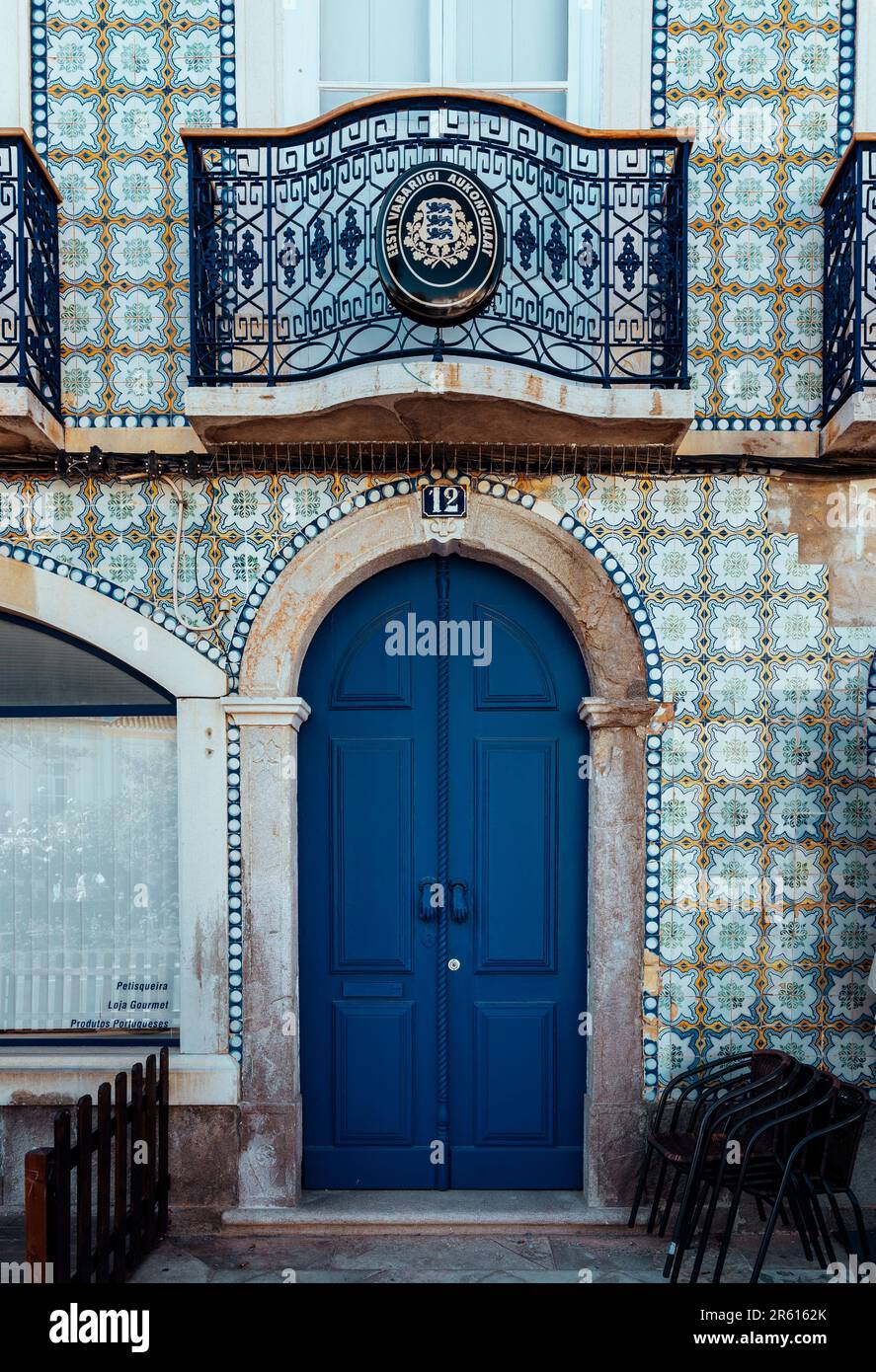 An aged blue door in an old building with tiled walls Stock Photo - Alamy