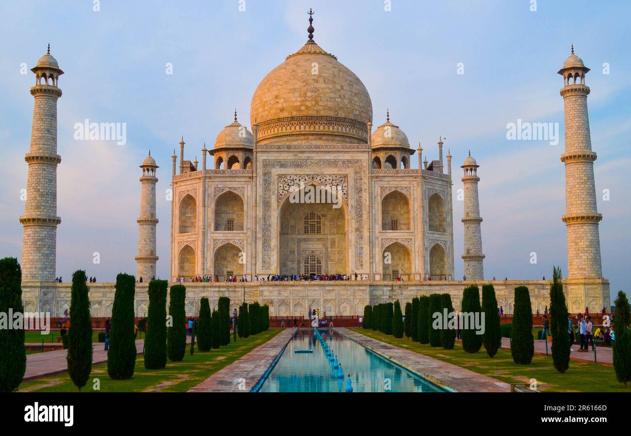 A stunning view of the Taj Mahal mausoleum illuminated by the golden ...