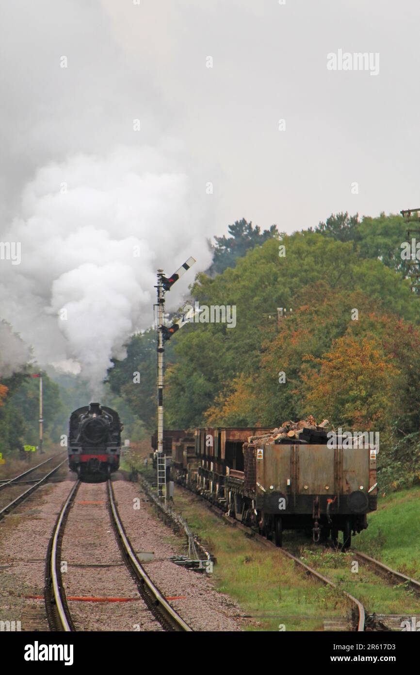 A Vintage Steam Train Engine Passing Freight Wagons Stock Photo - Alamy