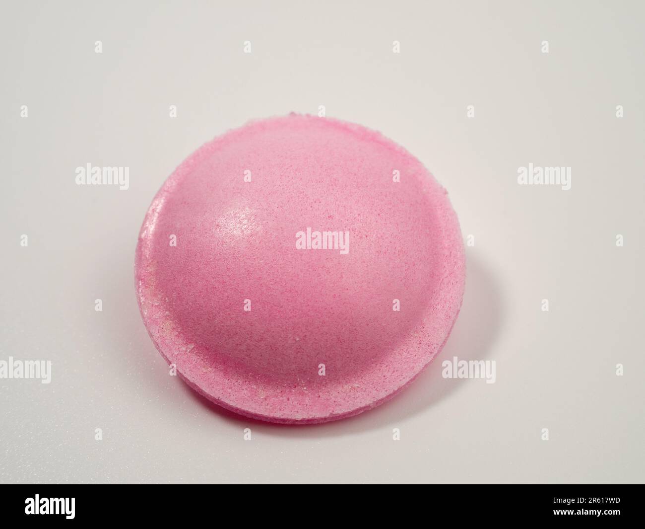 Sweet candies in the shape of a UFO in different colors on a white ...